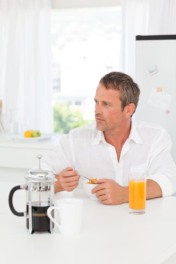 Handsome Man Having His Breakfast in the Kitchen Stock Photo - Image of ...