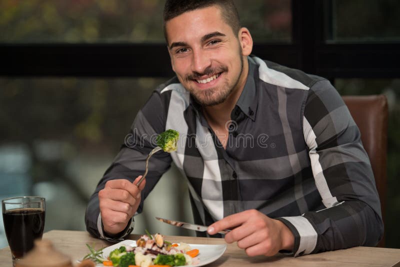 Handsome Man Having Lunch in a Restaurant Stock Photo - Image of ...