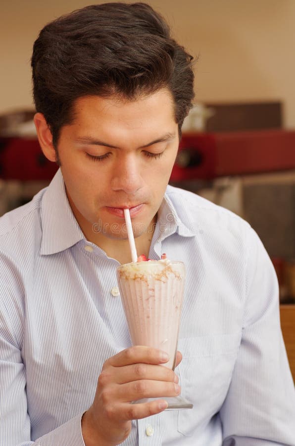 Handsome Man Having a Milkshake with a Plastic Straw Stock Image ...