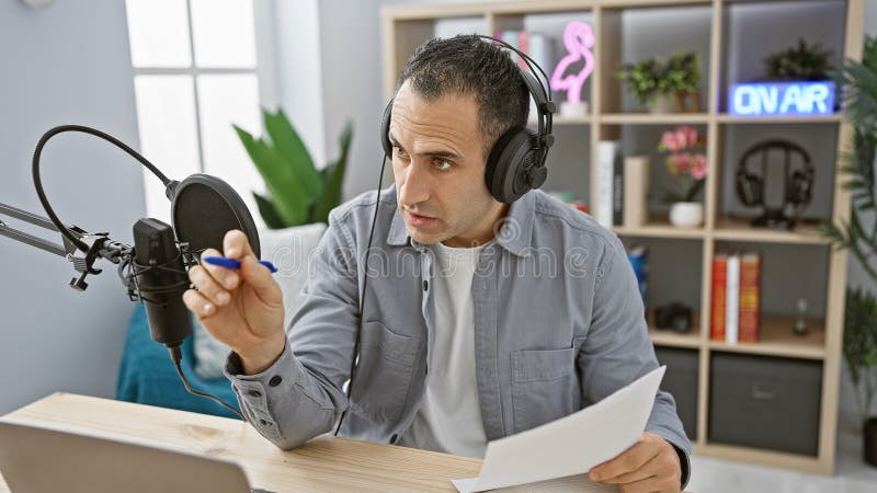 Handsome Man with Headphones in Radio Studio Holding Script on-air ...