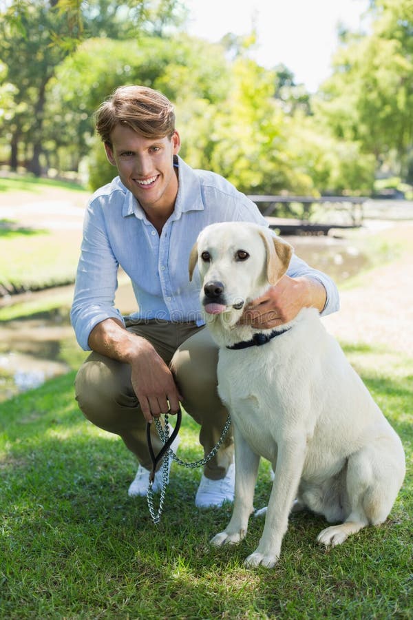 Handsome Man with His Labrador in the Park Smiling at Camera Stock ...