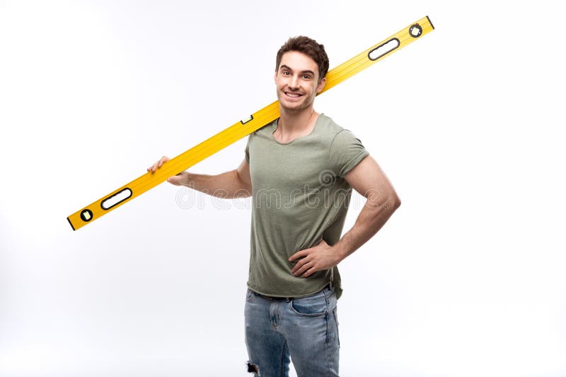 Handsome Man Holding Building Level Isolated on White Stock Photo ...