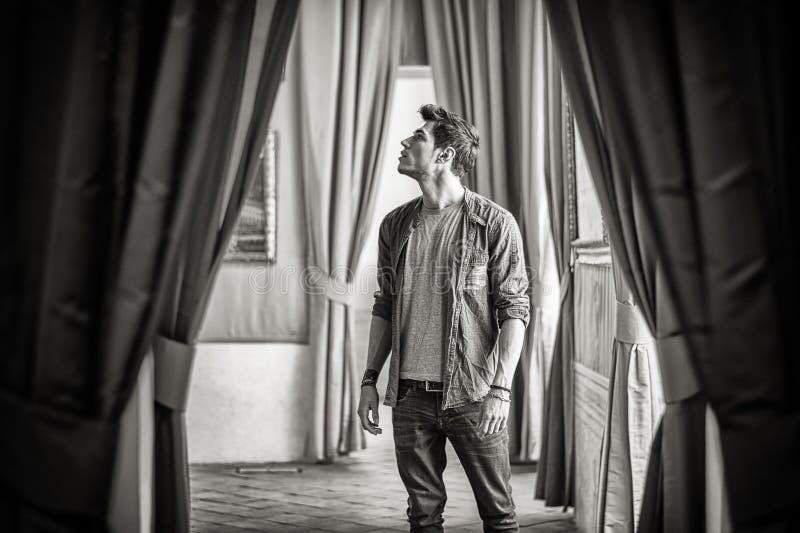 Handsome Man Holding a Guide Inside a Museum Stock Photo - Image of ...