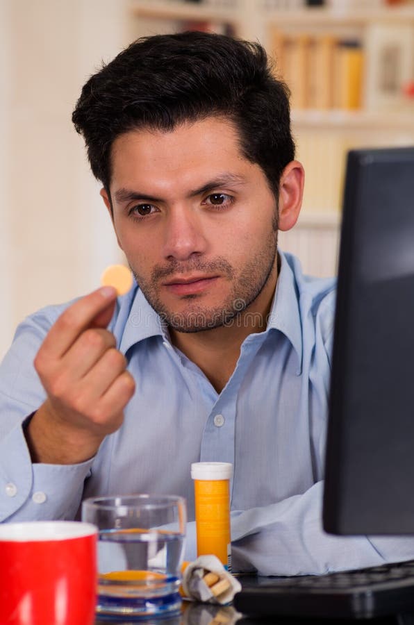 Handsome Man Holding a Pill Effervescent Tablet in His Hand in a Office ...