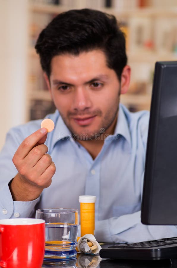 Handsome Man Holding a Pill Effervescent Tablet in His Hand in a Office ...