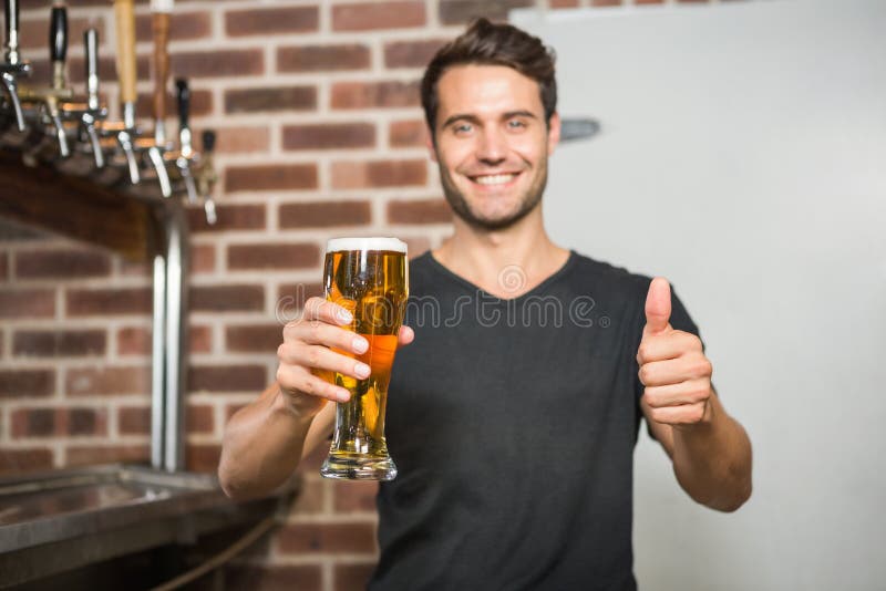 Handsome Man Holding a Pint of Beer with Thumbs Up Stock Image - Image ...