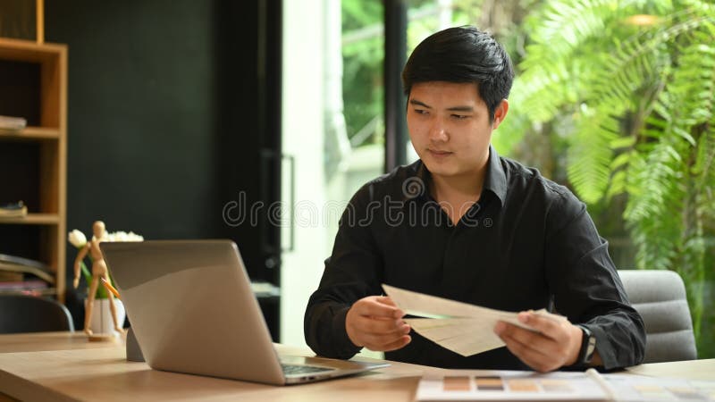 Handsome Man Interior Designers Using Laptop and Planning Construction ...