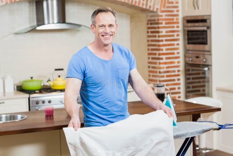 Handsome Man Ironing His Clothes Stock Image - Image of household ...
