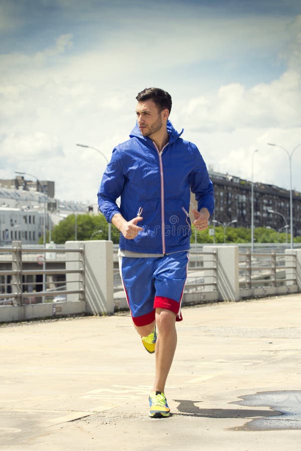 Handsome Man Jogging Outdoors Stock Photo - Image of outdoors, sports ...