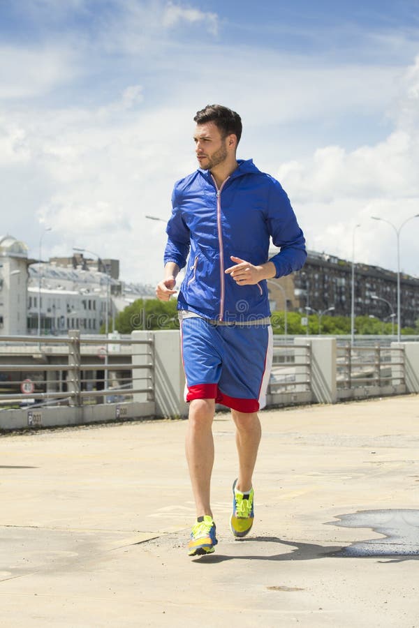Handsome Man Jogging Outdoors Stock Photo - Image of recreation ...
