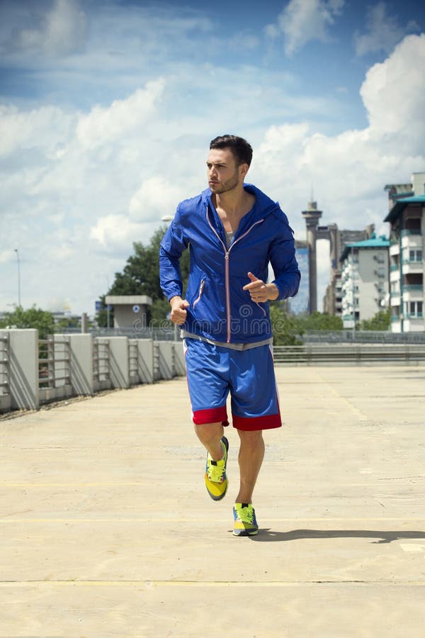 Handsome Man Jogging Outdoors Stock Photo - Image of outdoors, training ...