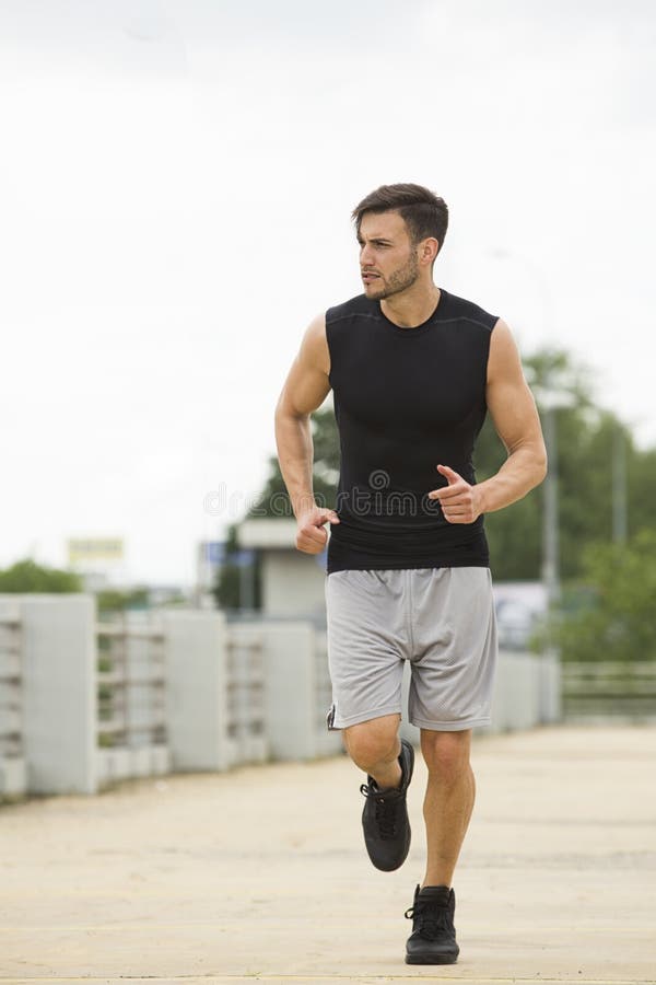Handsome Man Jogging Outdoors Stock Photo - Image of tracksuit, young ...