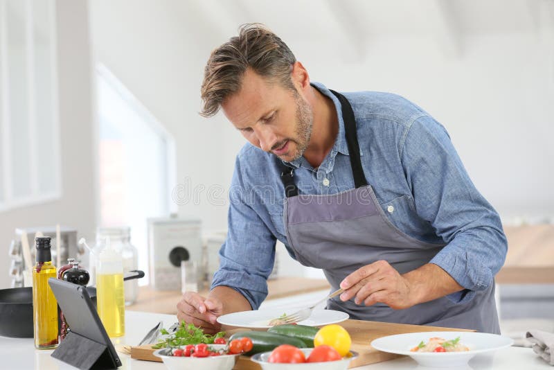 Handsome Man in the Kitchen Cooking Stock Image - Image of dish ...