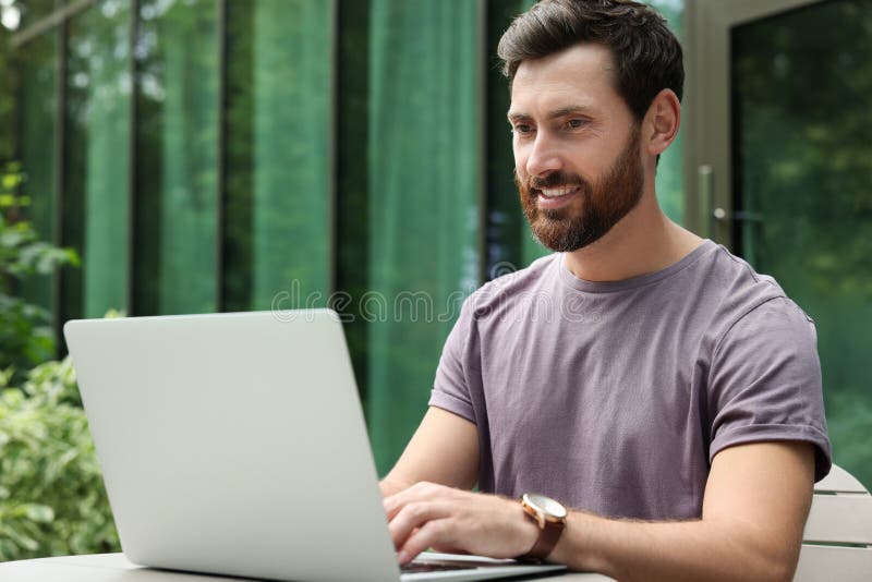 Handsome Man with Laptop in Outdoor Cafe Stock Photo - Image of laptop ...