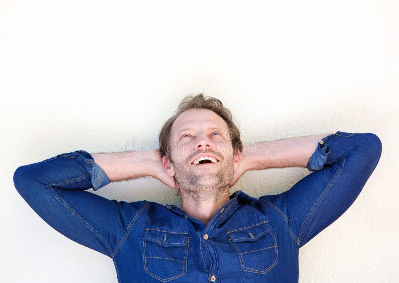 Handsome Man Laughing with Hands Behind Head and Looking Up Stock Image ...