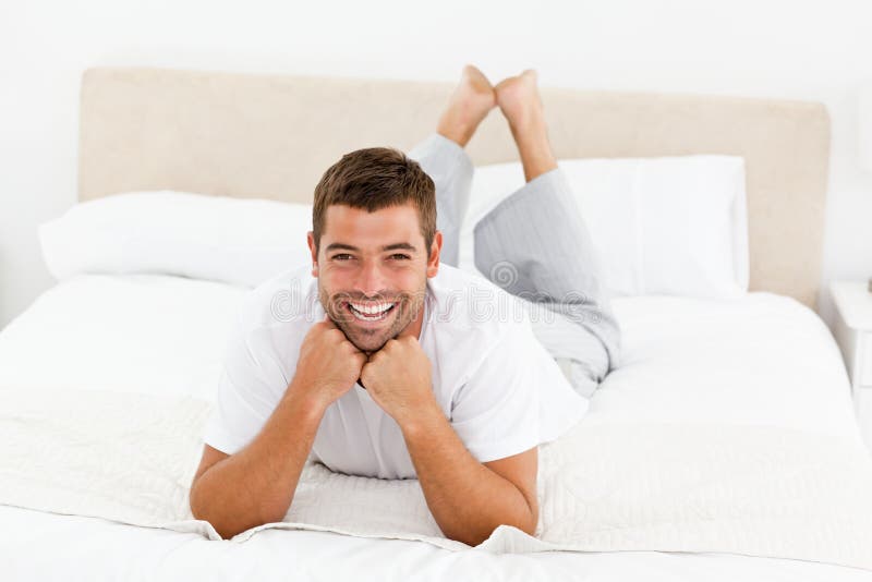 Handsome Man Laughing Lying on His Bed Stock Image - Image of alone ...