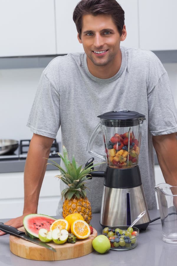 Handsome Man Leaning on the Counter of His Kitchen Stock Photo - Image ...