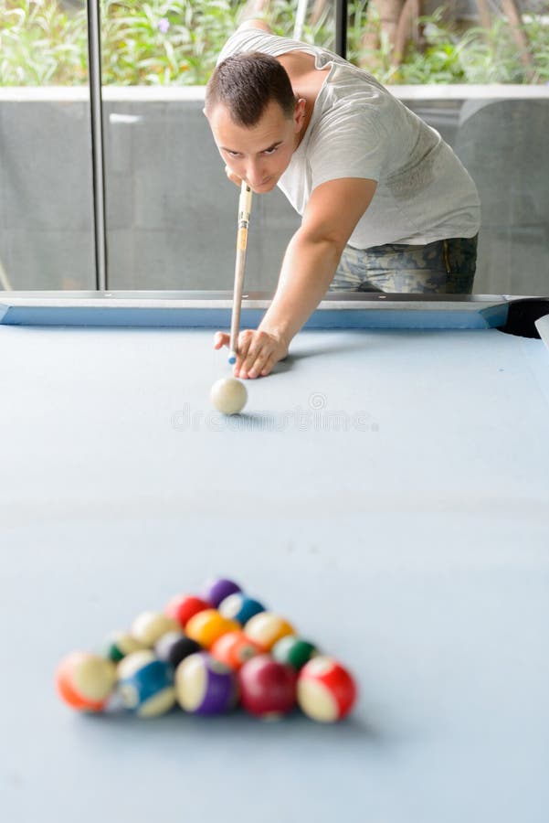 Handsome Man Leaning on Pool Table while Playing Billiard Stock Photo ...