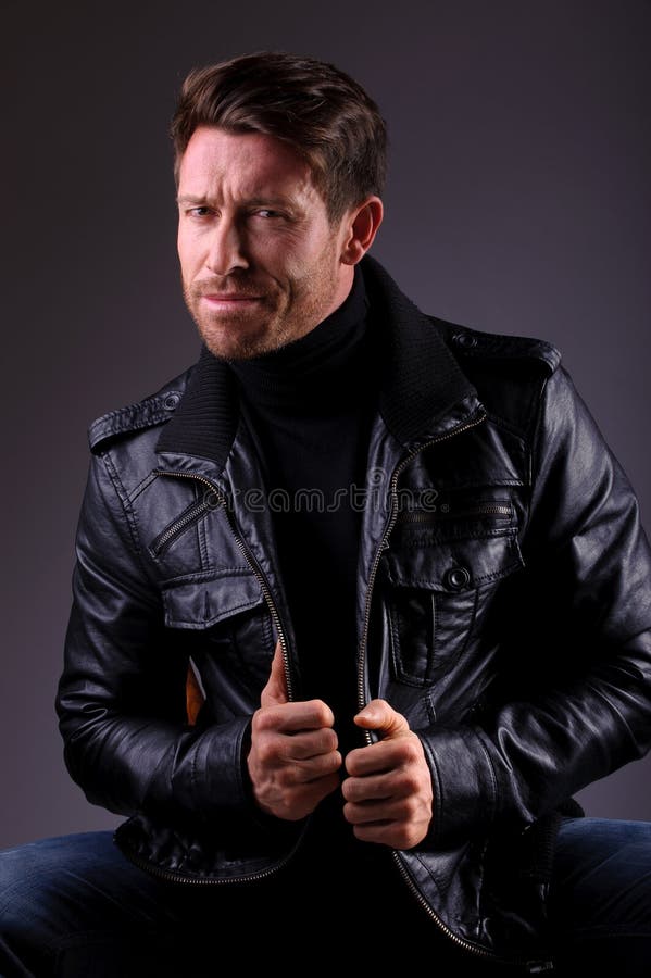 Handsome Man in Leather Jacket Seated Stock Image - Image of charming ...