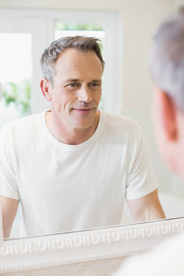 Handsome Man Looking at Himself in the Mirror Stock Image - Image of ... Handsome Man Looking at Himself in the Mirror Stock Image - Image of ...
