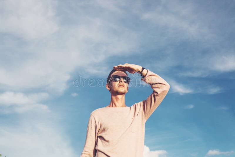 Handsome Man Looking at the Horizon with a Blue Sky in the Background ...