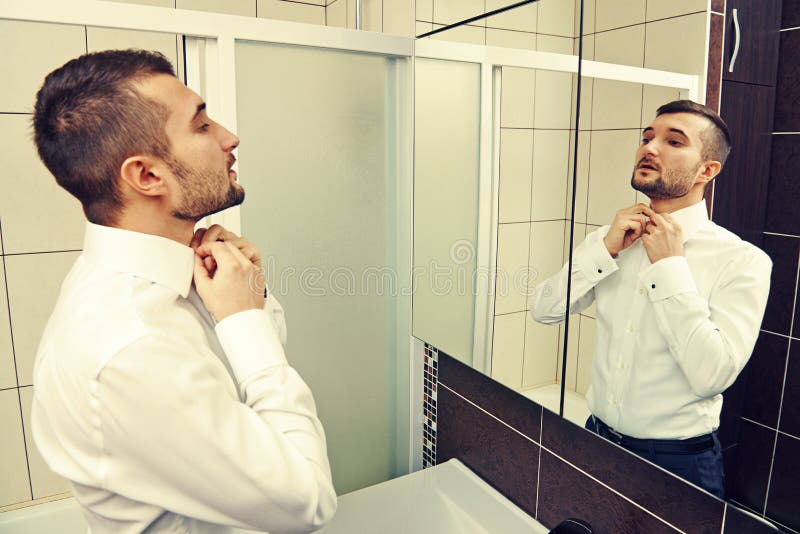 Handsome Man Looking at Mirror Stock Photo - Image of handsome ...