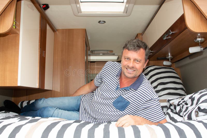 Handsome Man Lying in Camper Van Bed in Motor Home on Vacation Day RV ...
