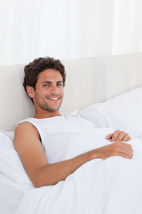 Handsome Man Lying Down in His Bed Stock Image - Image of cheerful ...