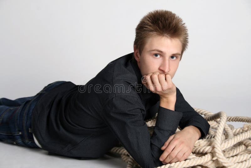 Handsome man lying on rope stock image. Image of funny - 11420483