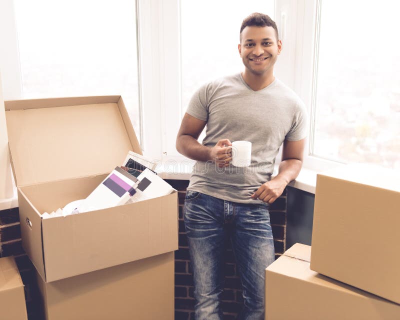 Handsome man moving stock image. Image of house, packing - 80995425