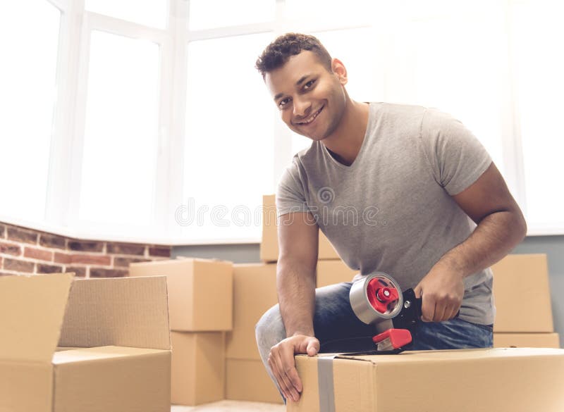 Handsome man moving stock photo. Image of adhesive, male - 80996386