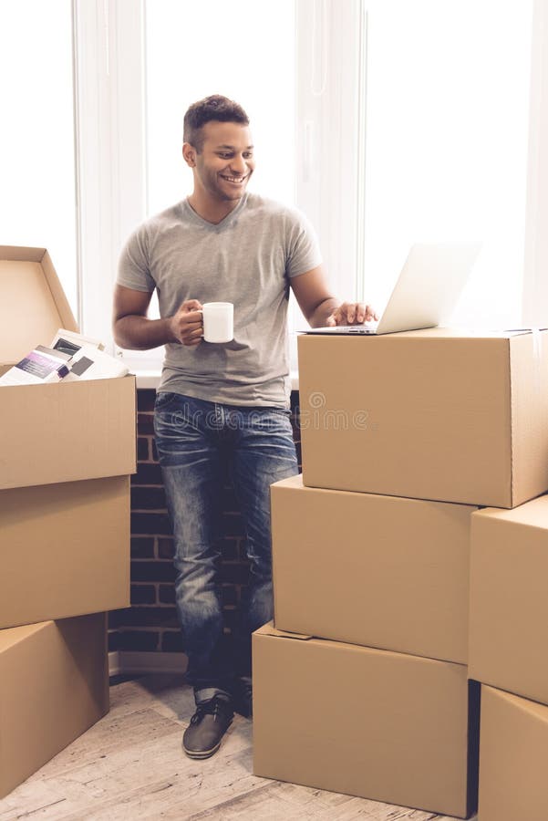 Handsome man moving stock image. Image of estate, person - 80996681