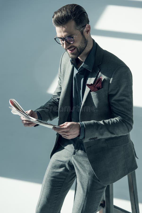 Handsome Man with Newspaper Stock Image - Image of posing, young: 90423107