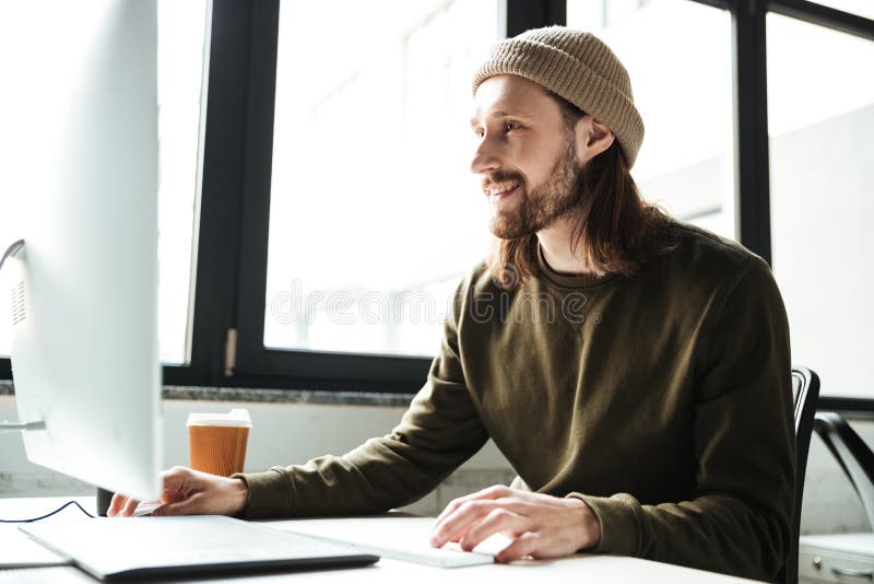 Handsome Man in Office Using Computer. Looking Aside Stock Photo ...