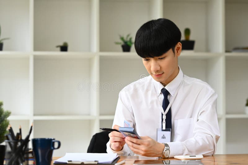 Handsome Man Office Worker Checking Message or Emails on Smartphone ...