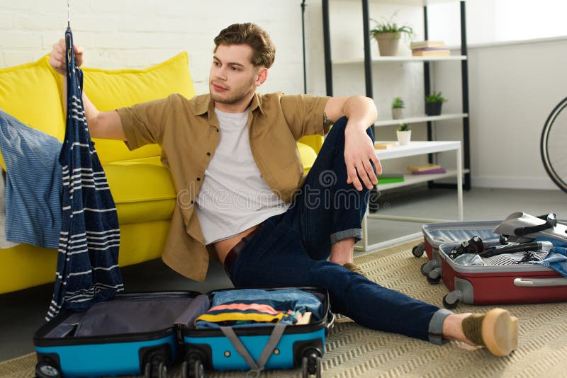 Handsome Man Packing Clothes in Suitcases Stock Image - Image of ...