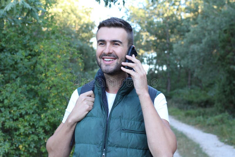 Handsome Man Phoning in the Park. Beautiful Man with Hand on the Face ...