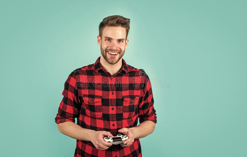 Handsome Man Play with Game Console. Modern Technology and Engineering ...