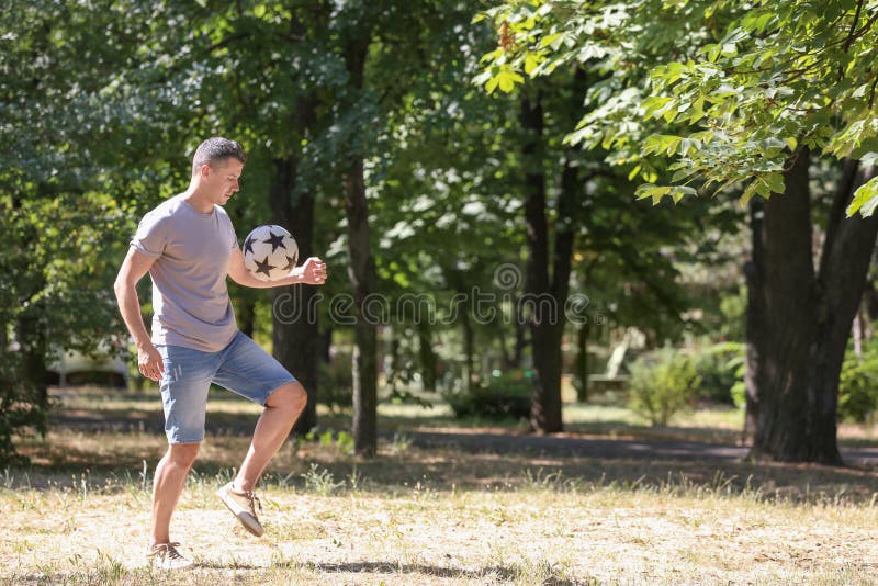 Handsome Man Playing Football Outdoors Stock Image - Image of ball ...