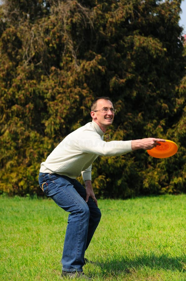 Handsome Man is Playing Frisbee Stock Image - Image of outdoor, energy ...