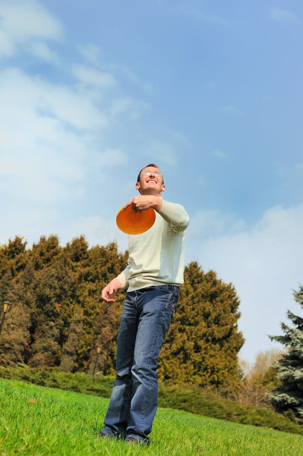 Handsome Man is Playing Frisbee Stock Image - Image of lifestyle, speed ...