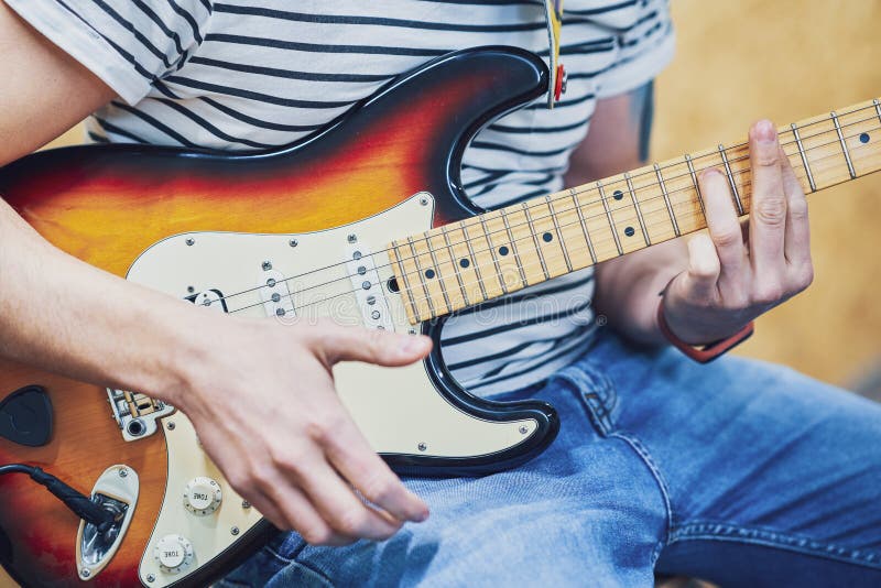 Handsome Man Playing Guitar in Studio Stock Image - Image of beauty ...