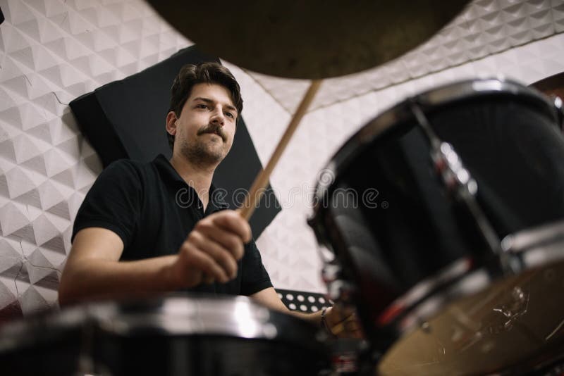 Handsome Man Playing with Drumsticks while Sitting in Music Studio ...
