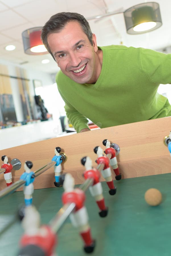 Handsome Man Playing Table Football Stock Photo - Image of casual ...
