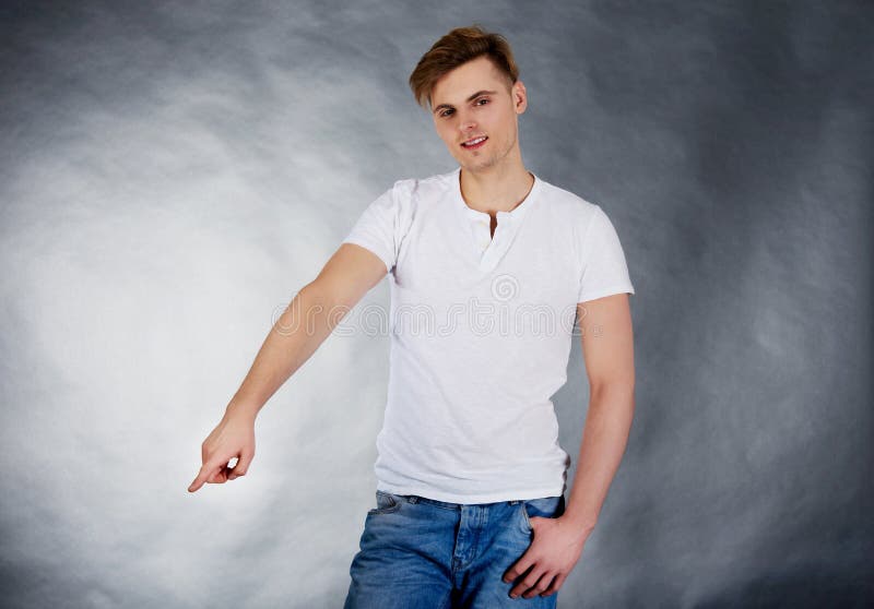 Handsome Man Pointing Down. Stock Image - Image of single, empty: 54844117