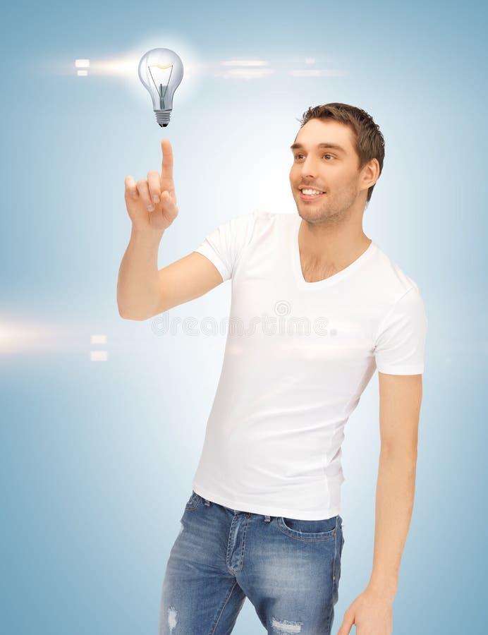 Handsome Man Pointing at Light Bulb Stock Photo - Image of economy ...