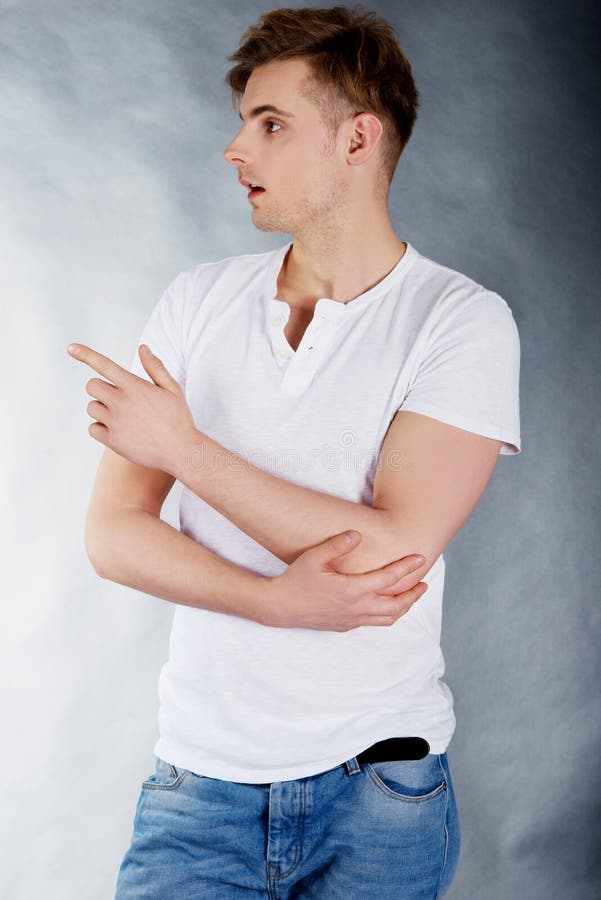 Handsome Man Pointing To the Left. Stock Image - Image of promotion ...