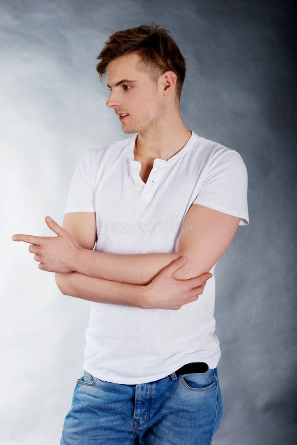 Handsome Man Pointing To the Left. Stock Image - Image of casual ...