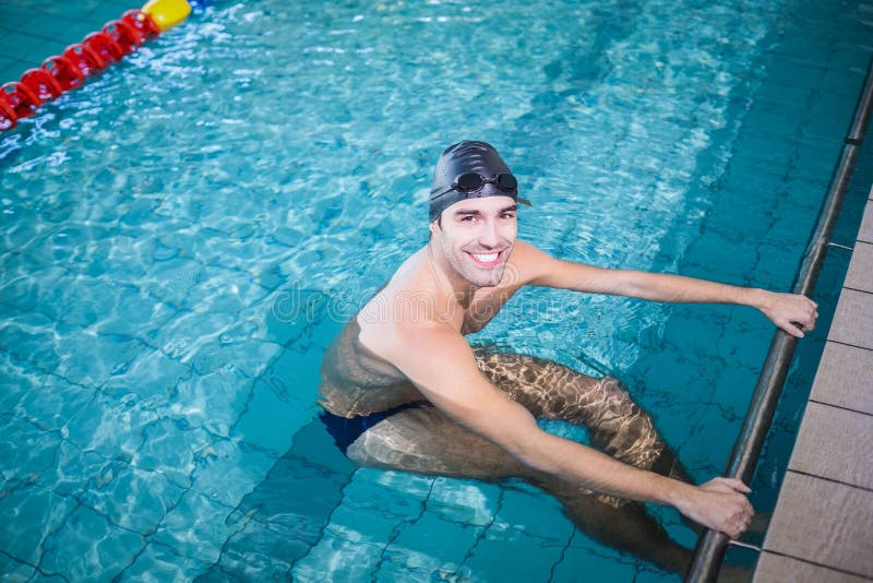 Handsome man in the pool stock image. Image of center - 66173261