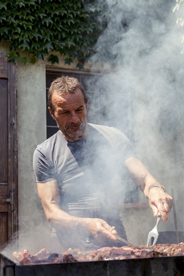 Handsome Man Preparing Grilled Meat Stock Photo - Image of chicken ...
